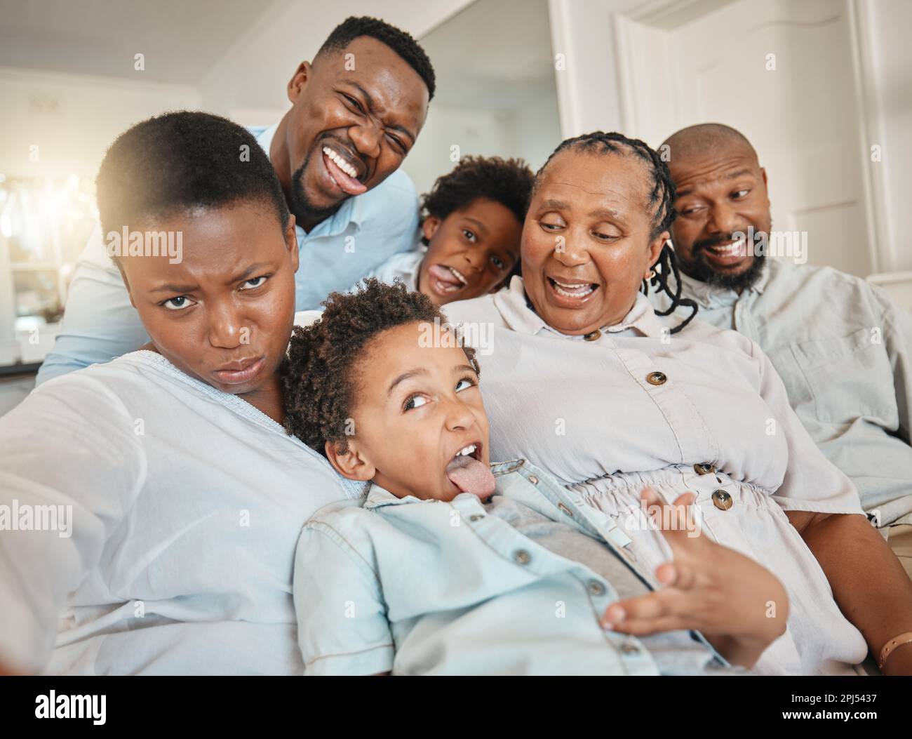 Funny, goofy and selfie of black family make joke with faces in a home ...