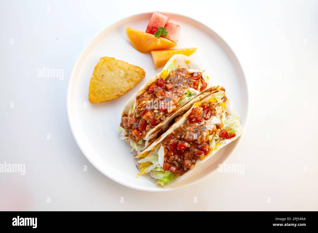 Soft shell delicious tacos for breakfast with hash brown and seasonal ...