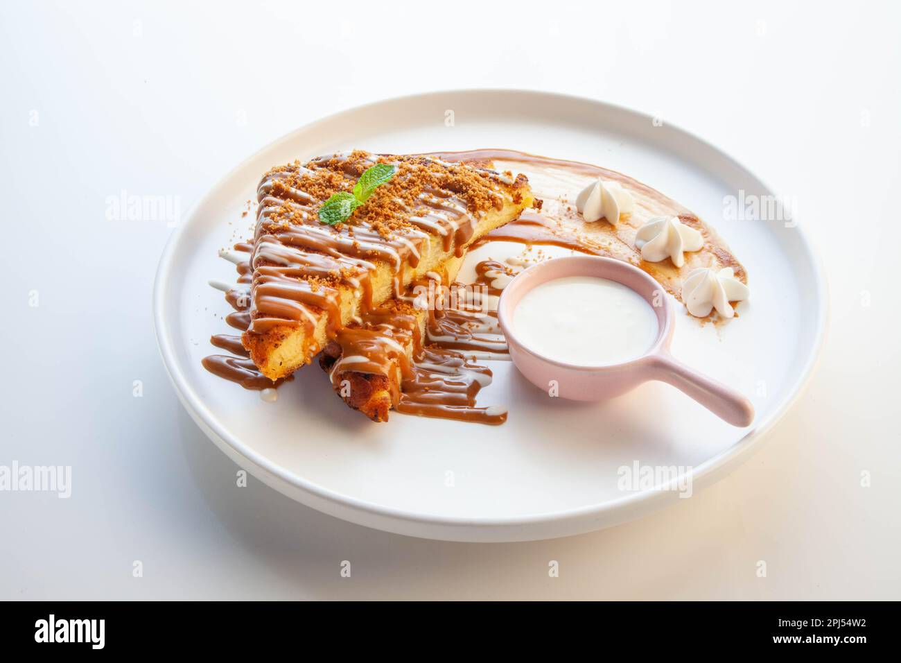 French toast in lotus crunch biscuit flavour served on a white plate ...