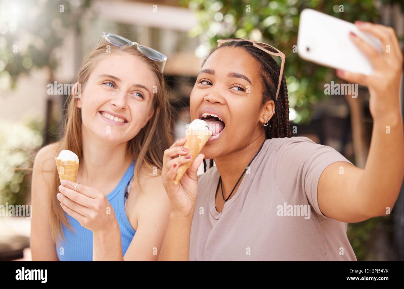 Friends eating ice cream, selfie outdoor with travel and happy with ...
