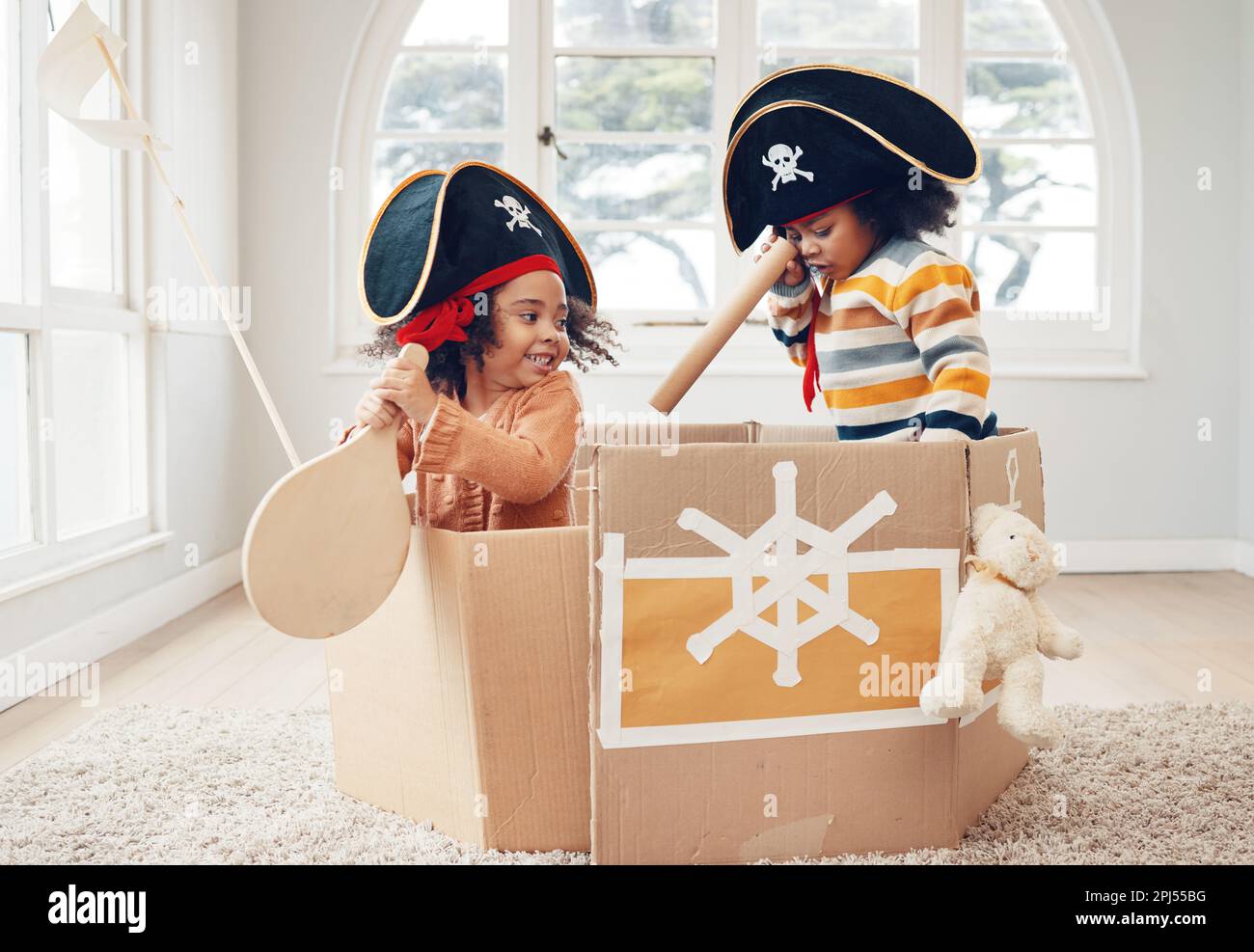 Playing, box ship and pirate kids role play, fantasy imagine or pretend ...