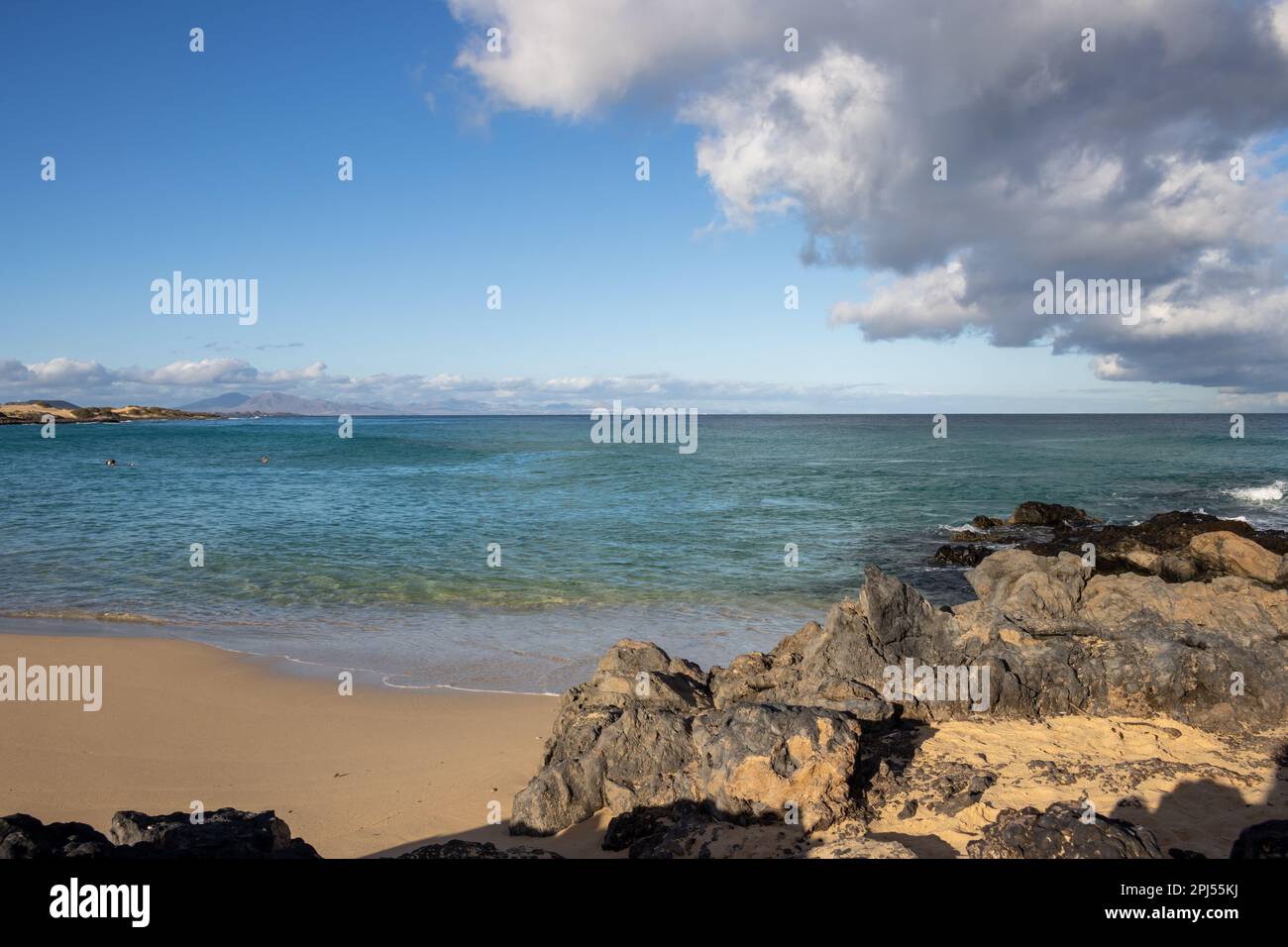 Combination of a sand and rocky coast at the beach of Atlantic ocean ...
