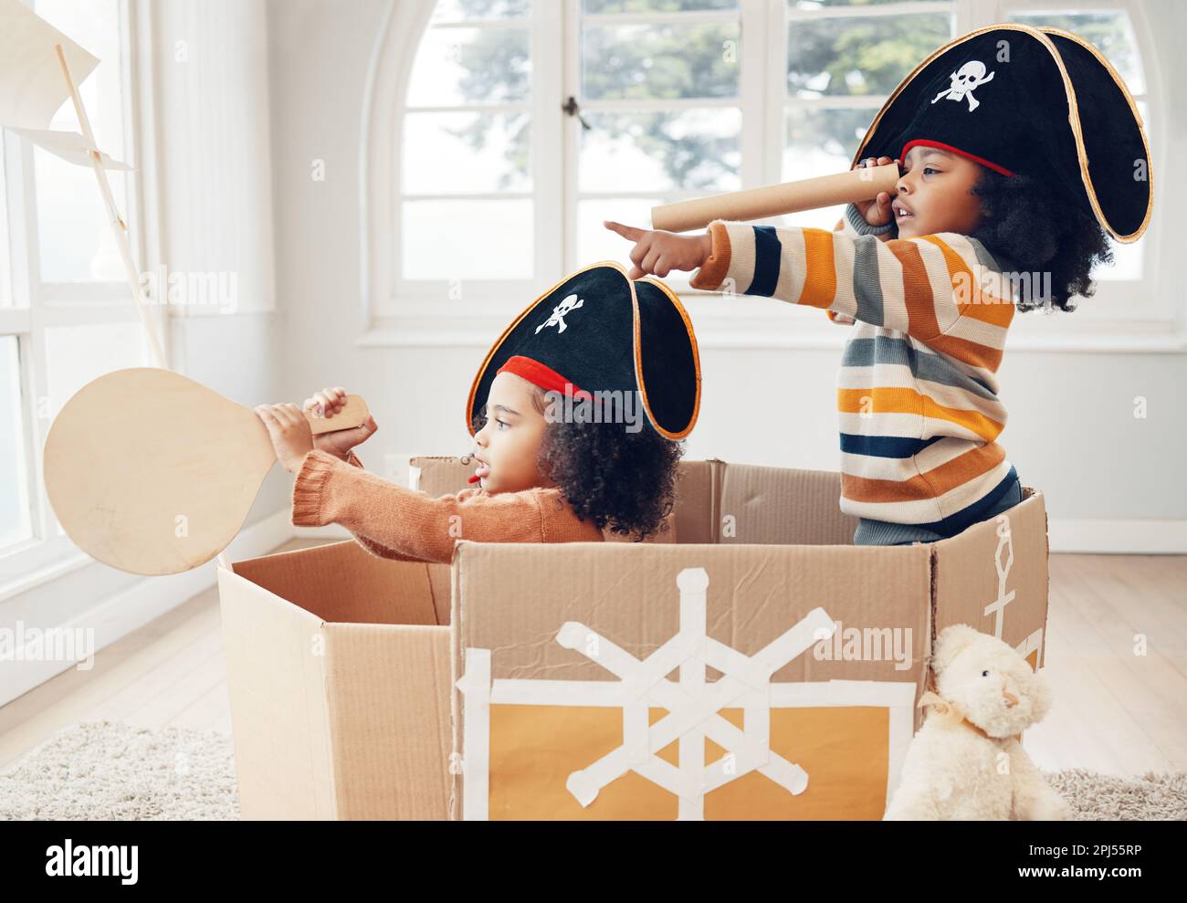Pirate, box and playing with children in living room for bonding ...
