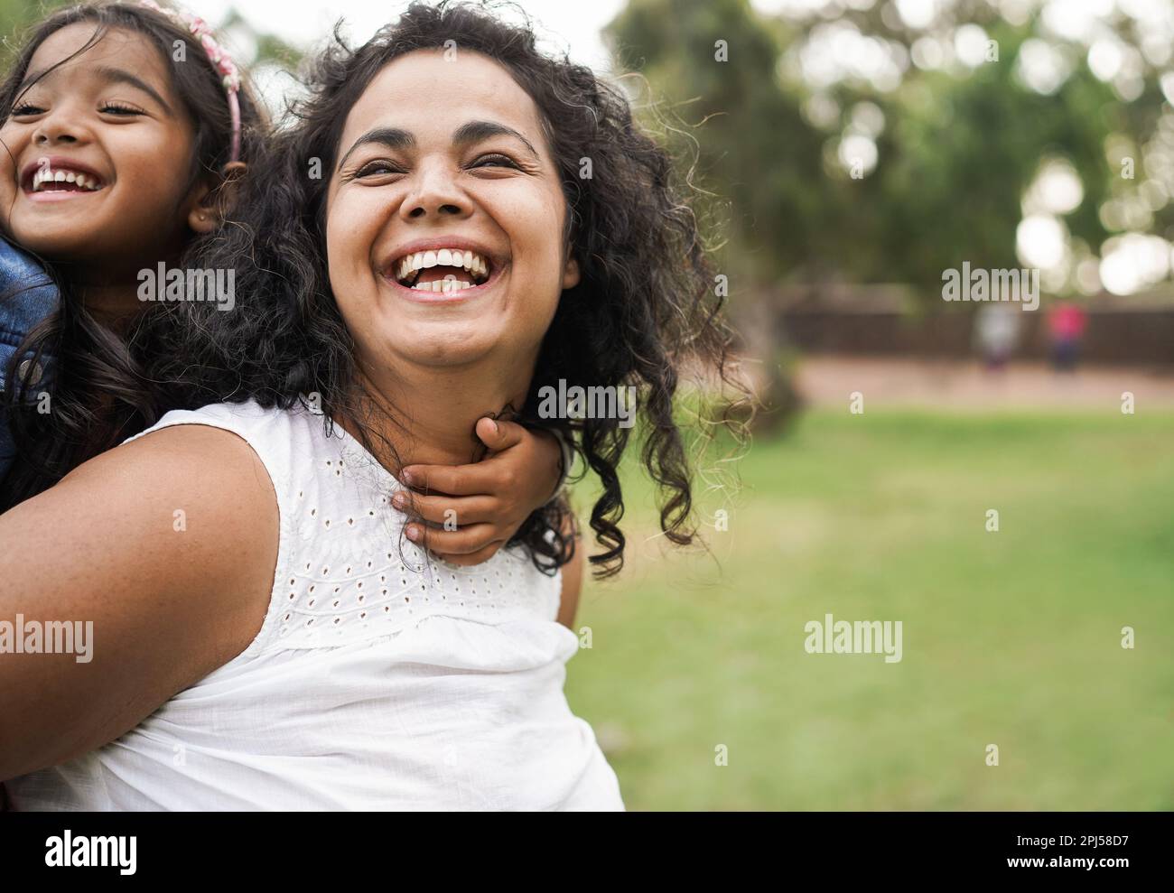 Asian Mother And Daughter Having Fun Outdoor Happy