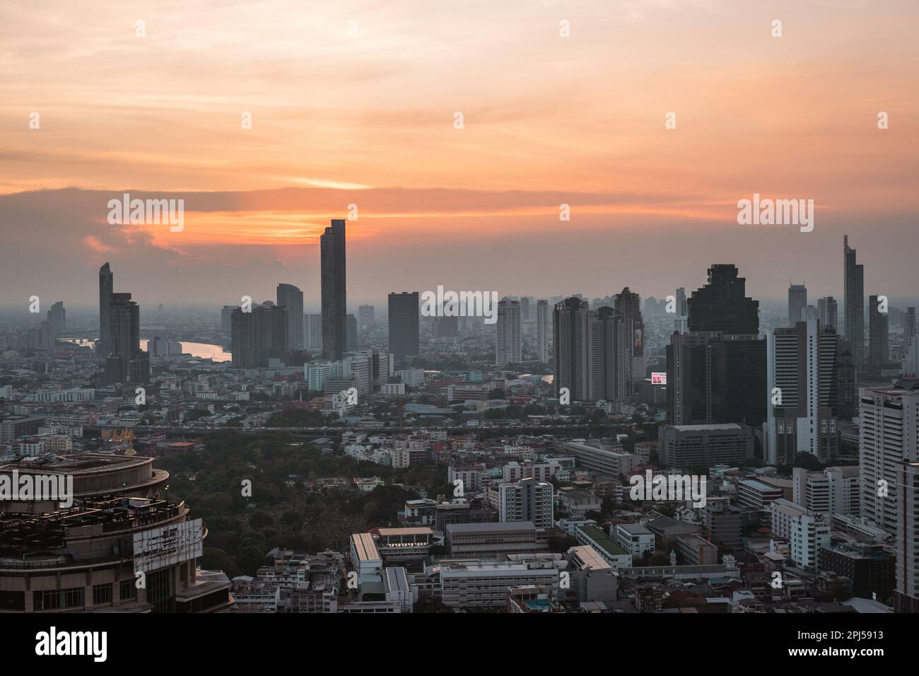 The skyline of Bangkok featuring a cluster of high-rise buildings and ...