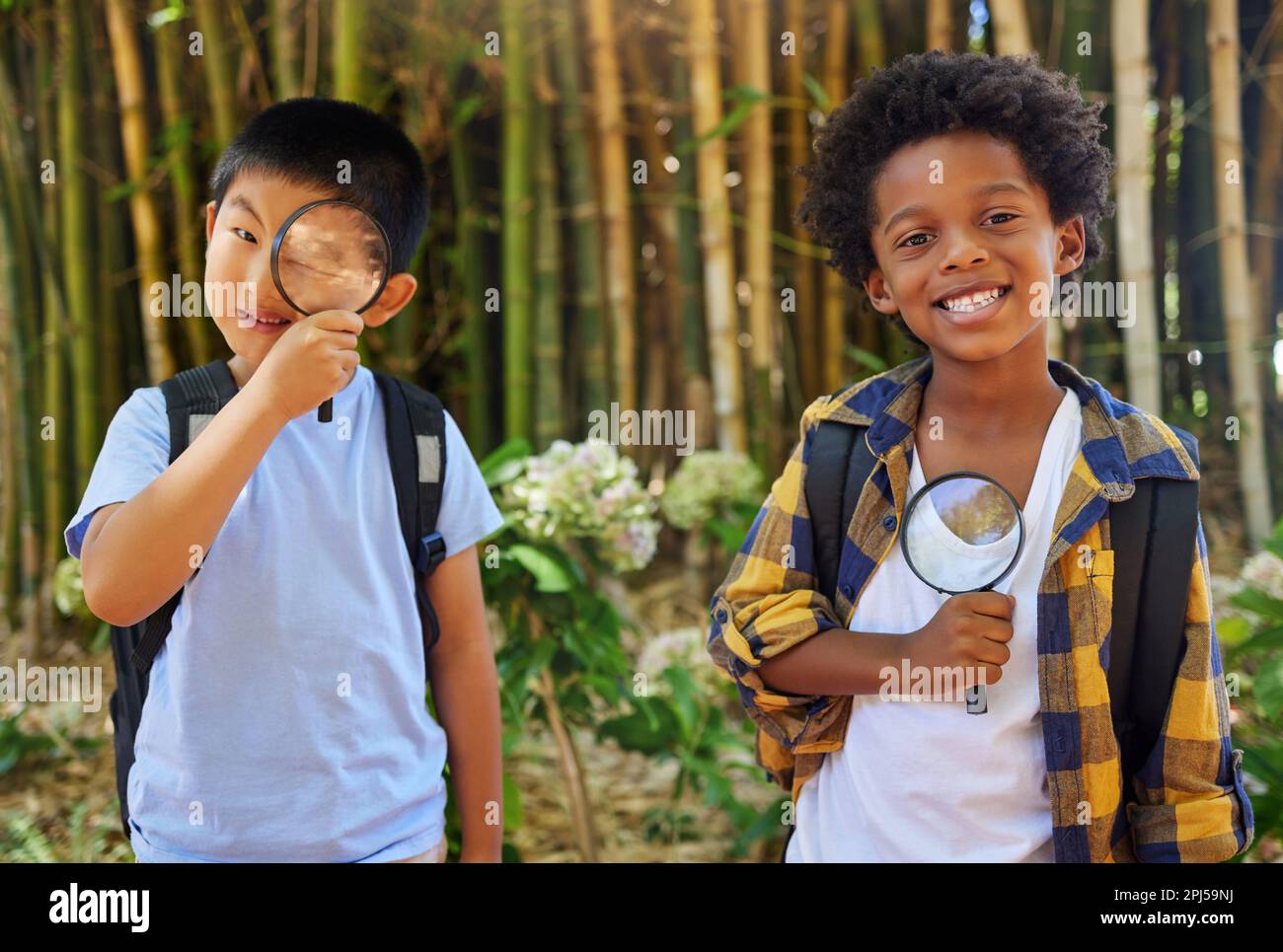 Nature, magnifying glass and portrait of curious children exploring in ...