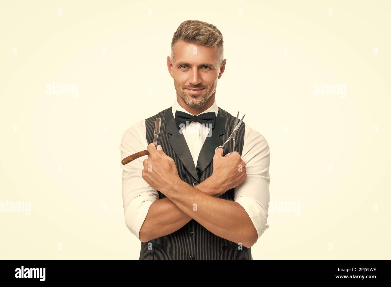 happy man barber with razor blade and scissors in bow tie isolated on ...