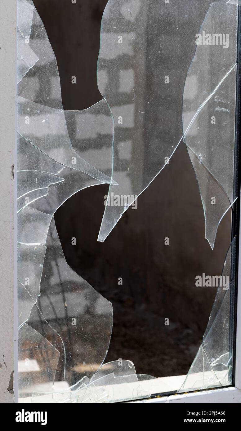 bullet hole in glass is a real bullet hole of a large caliber ...