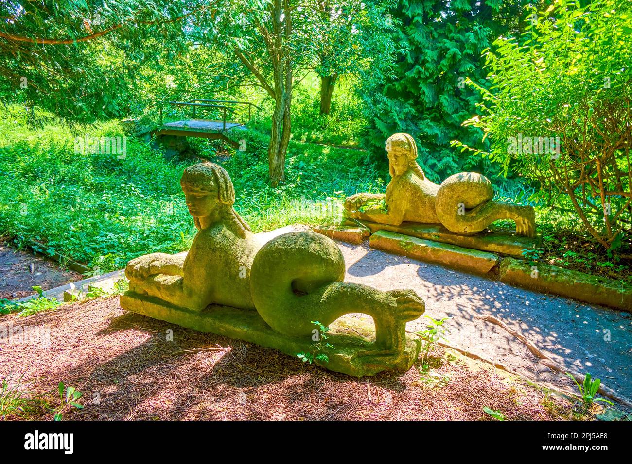 The sculptures of two mermaids at the spring in landscape garden of ...