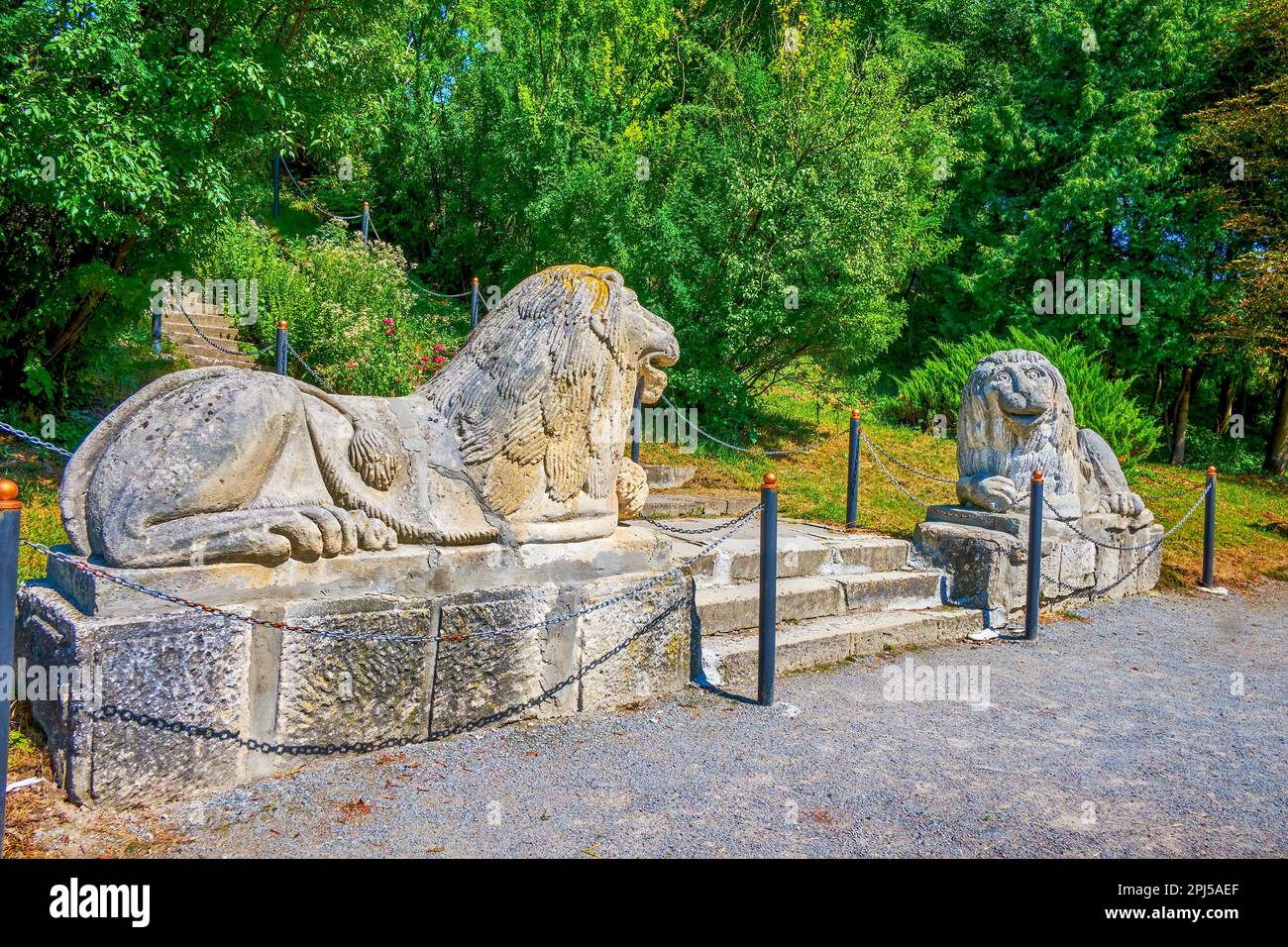 The sculptures of lions in landscape garden of Olesko Castle, Ukraine ...