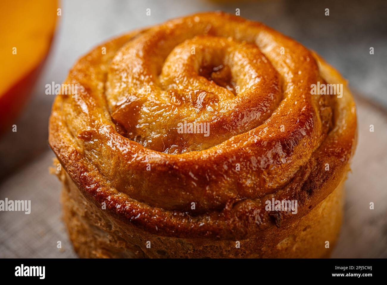 Fresh baked sweet swirl bun roll on serving board Stock Photo - Alamy