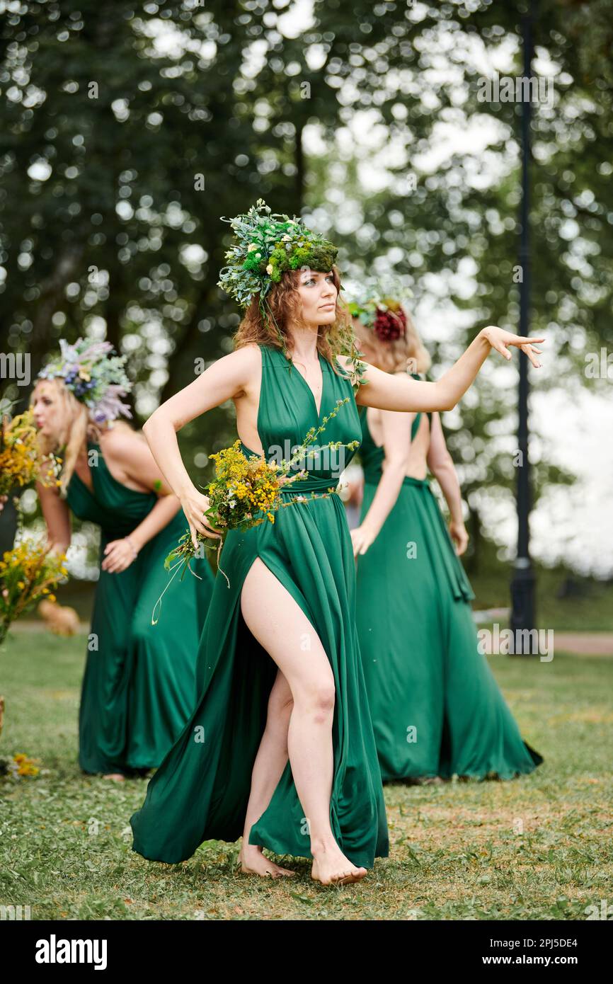 Svetlogorsk, Russia - 2022.08.13 - Dancing girls dryads on green lawn ...