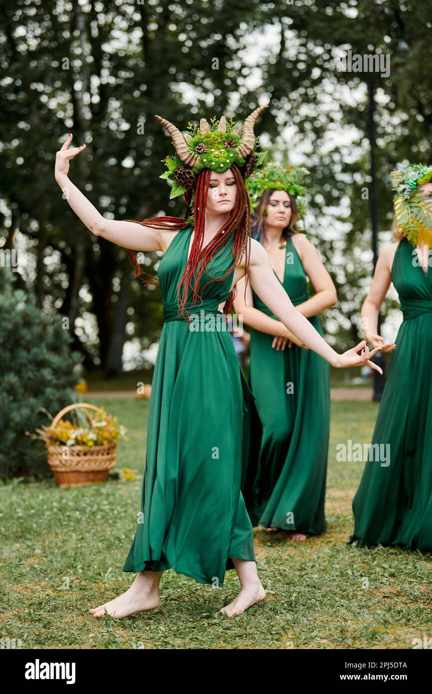 Svetlogorsk, Russia - 2022.08.13 - Two girls dryads dancing on green ...