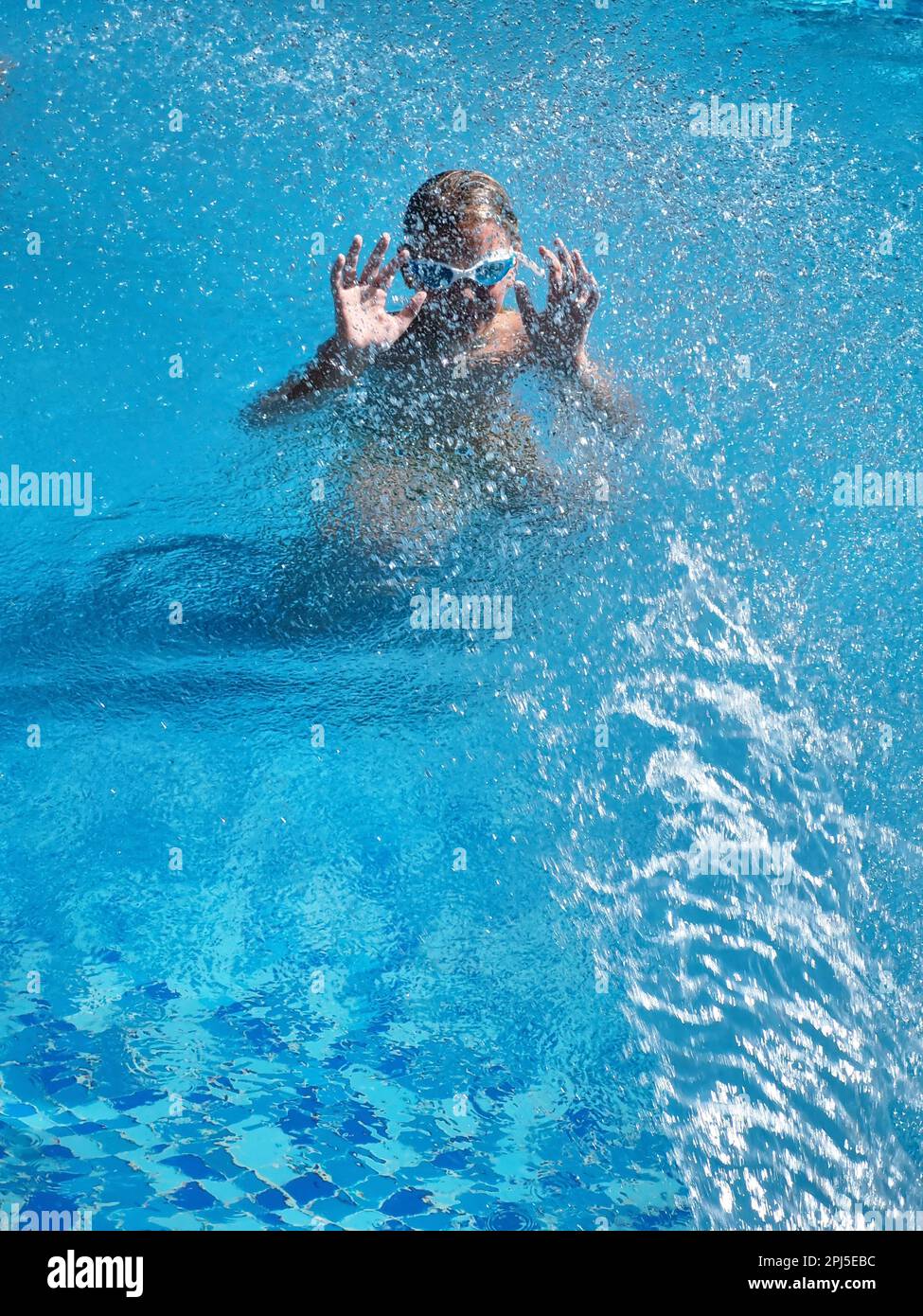 Teenage boy in swimming pool hi-res stock photography and images - Alamy