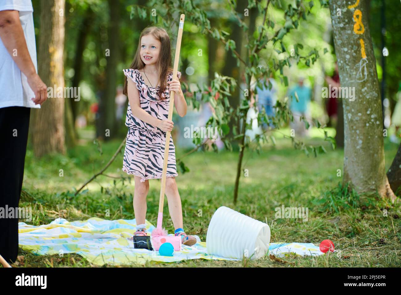 Svetlogorsk, Russia - 13.08.2022 - Young girl plays croquet with ...
