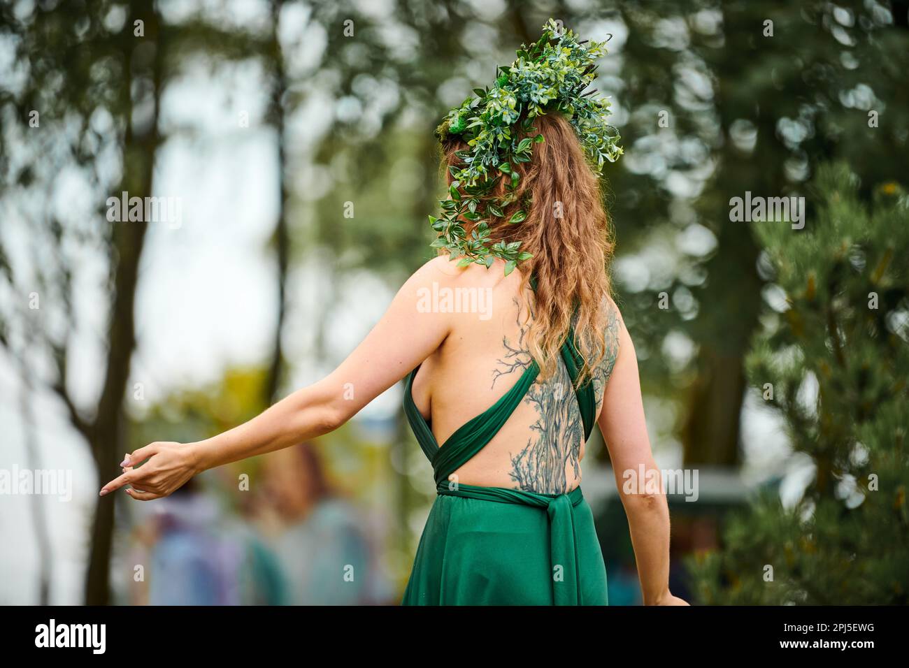 Svetlogorsk, Russia - 2022.08.13 - Girl dryad dancing rear view in ...
