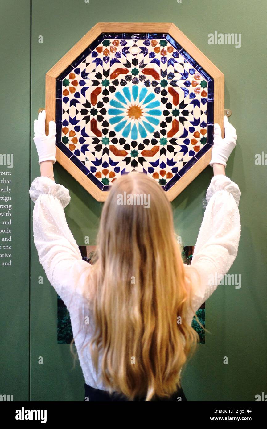 Exhibition curator Rosie Alderton adjusts a glazed ceramic Zillij tile ...