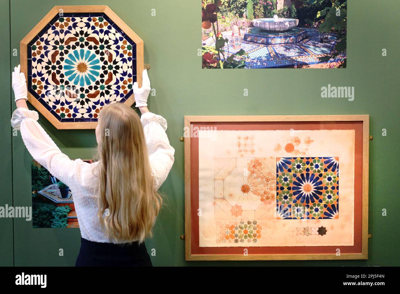 Exhibition curator Rosie Alderton adjusts a glazed ceramic Zillij tile ...