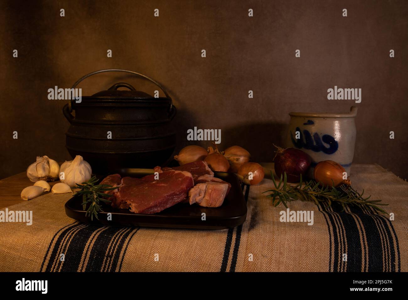 still life in a restarant with food as meat and garlic and other ...