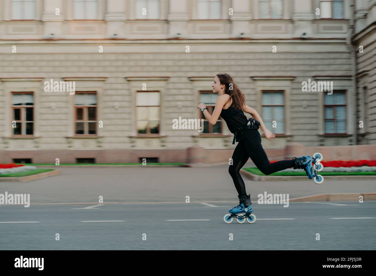 Outdoor physical activities. Healthy young woman has slim fit figure ...