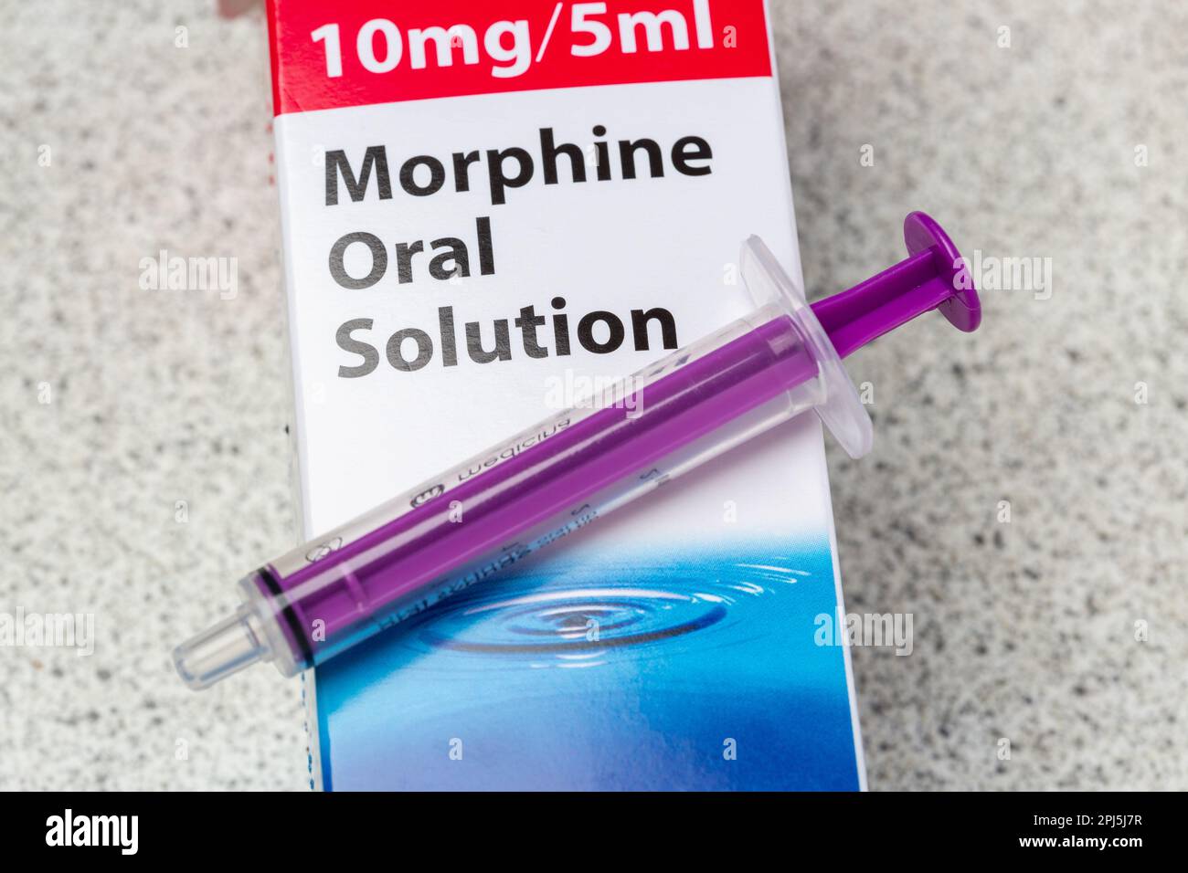 A close up of a box of Morphine Oral Solution with a Oral Syringe Stock ...