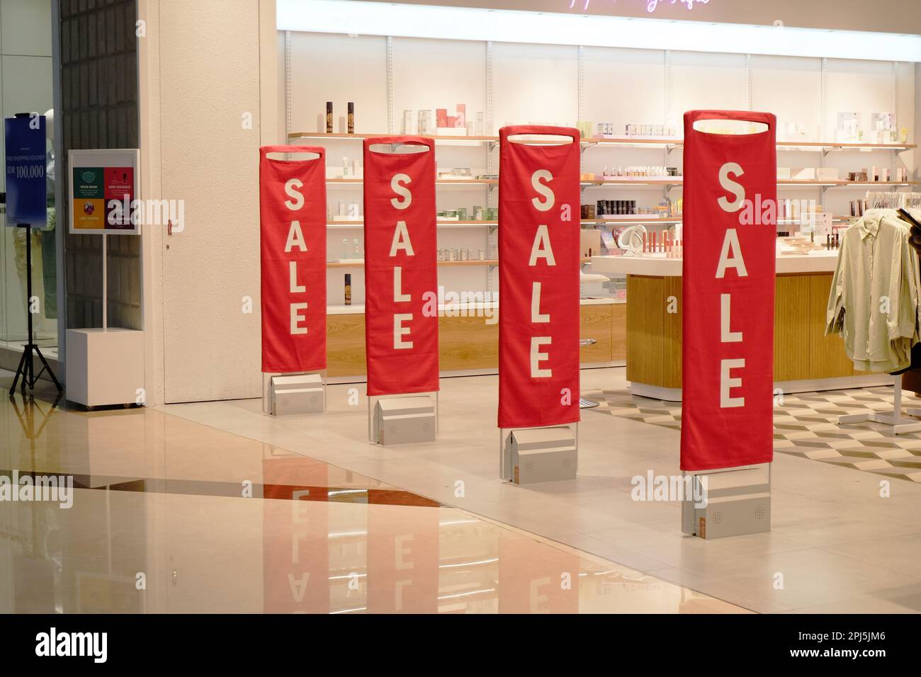 The red horizontal posters say SALE. Sale in the store. Red sale sign ...