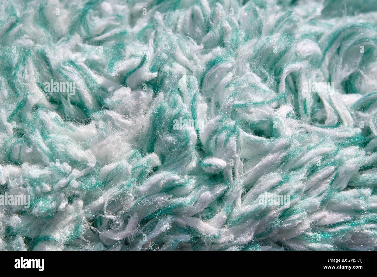 Close-up details of a surface of long soft pile paint roller, carpet ...