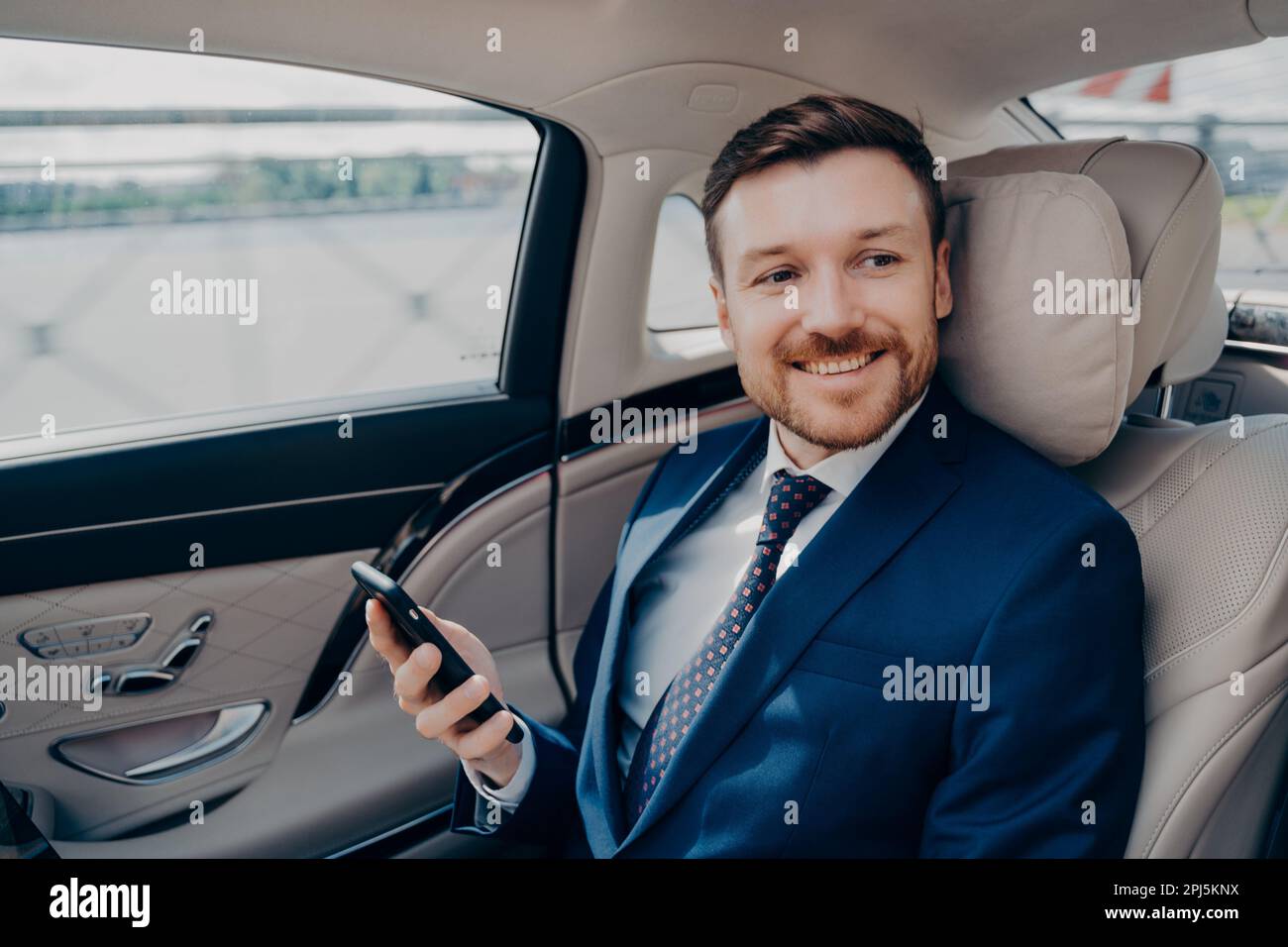 Person smiling in expensive car hi-res stock photography and images - Alamy