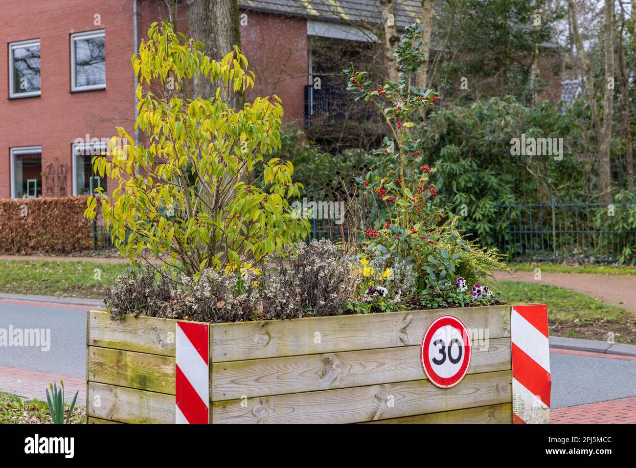 Plant box on the road to limit speed of traffic in Onnen municipality ...