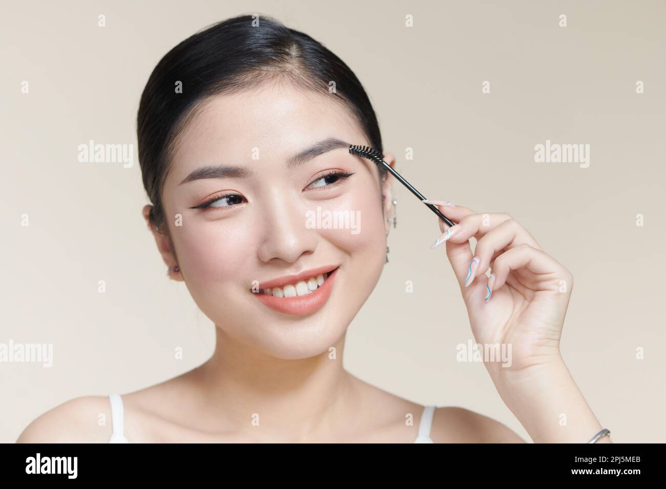 Woman Brushing Eyebrows With Brus Stock Photo - Alamy