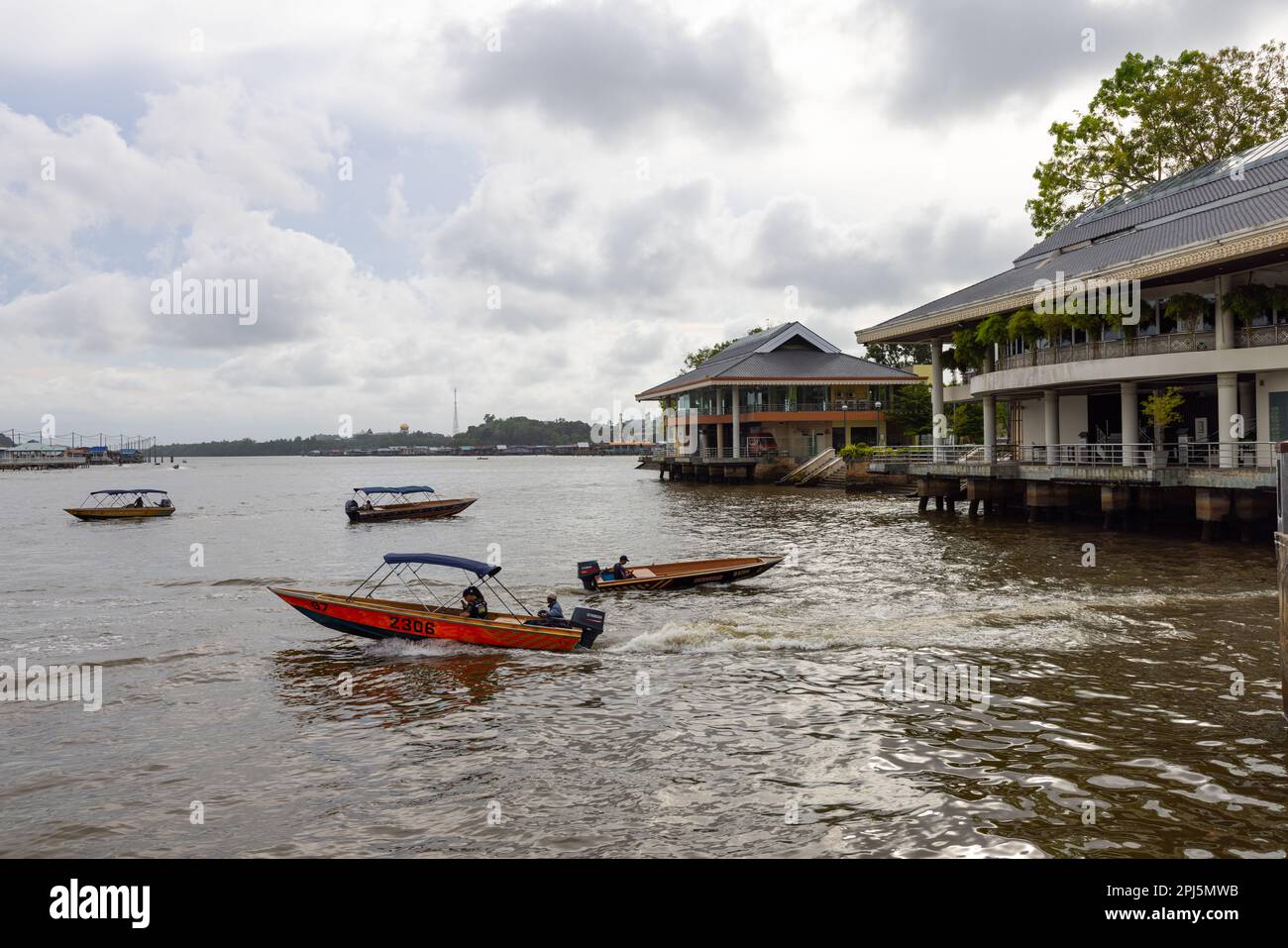 8 3 2023 trees, boat and building along Sungai Kedayan river, the ...