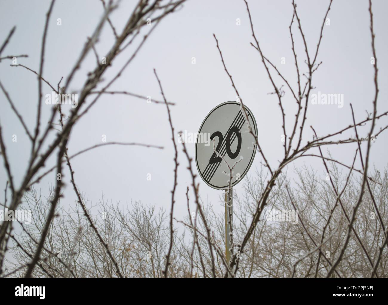 Sign the end of the maximum speed limit zone in the middle of the ...