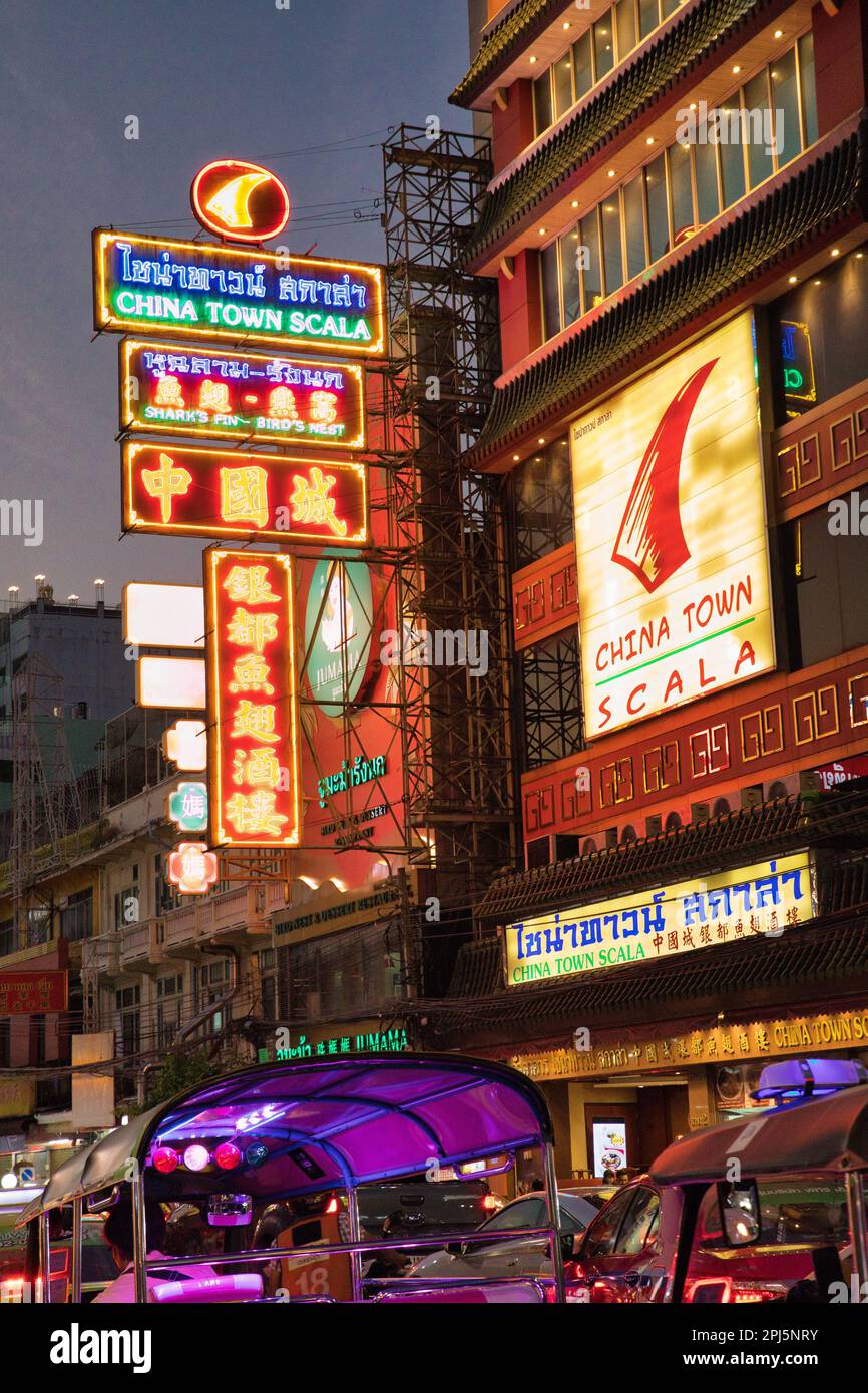Colorful, glowing neon billboards at night in the streets of Chinatown in Bangkok in Thailand ...