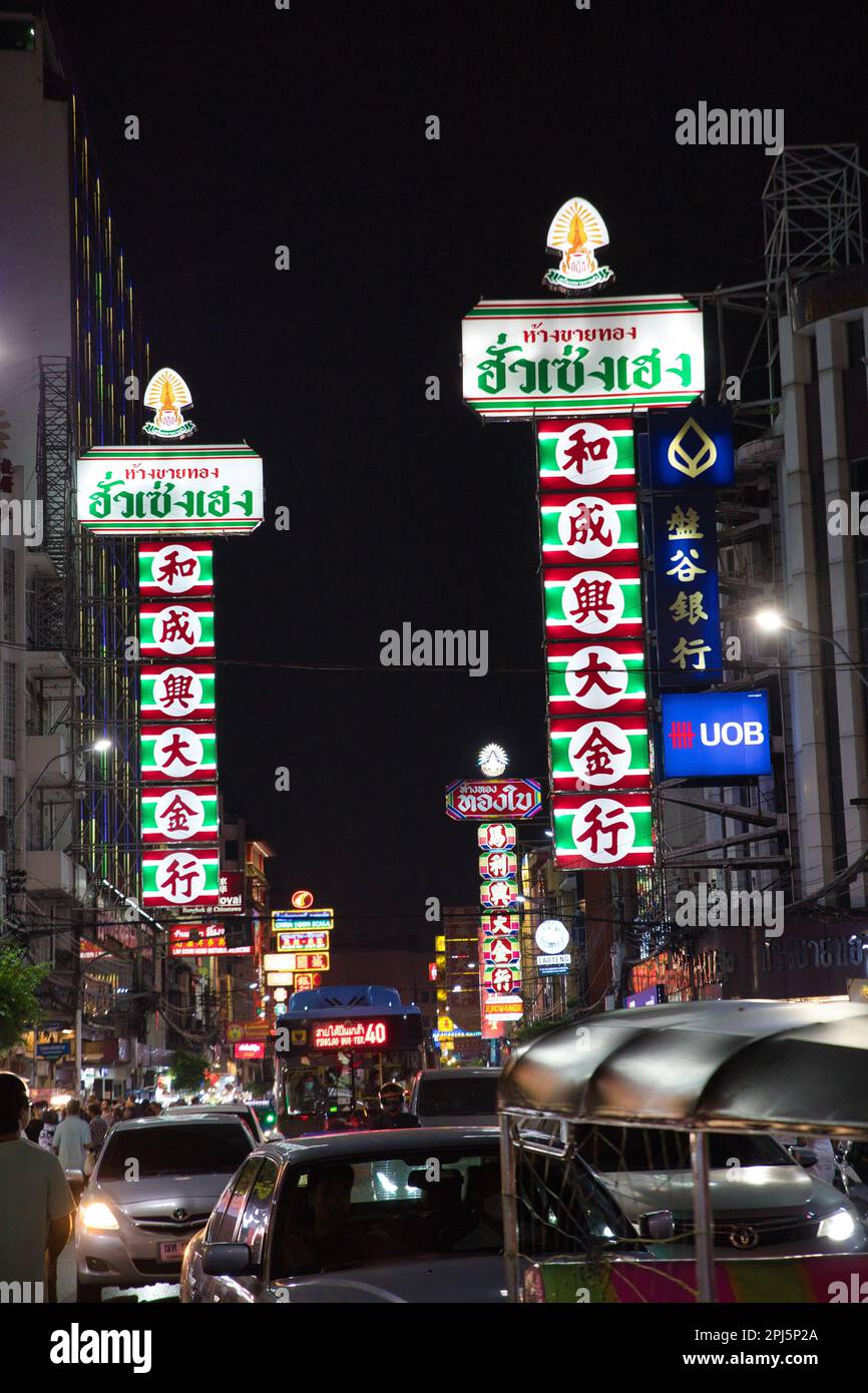 Colorful, glowing neon billboards at night in the streets of Chinatown in Bangkok in Thailand ...