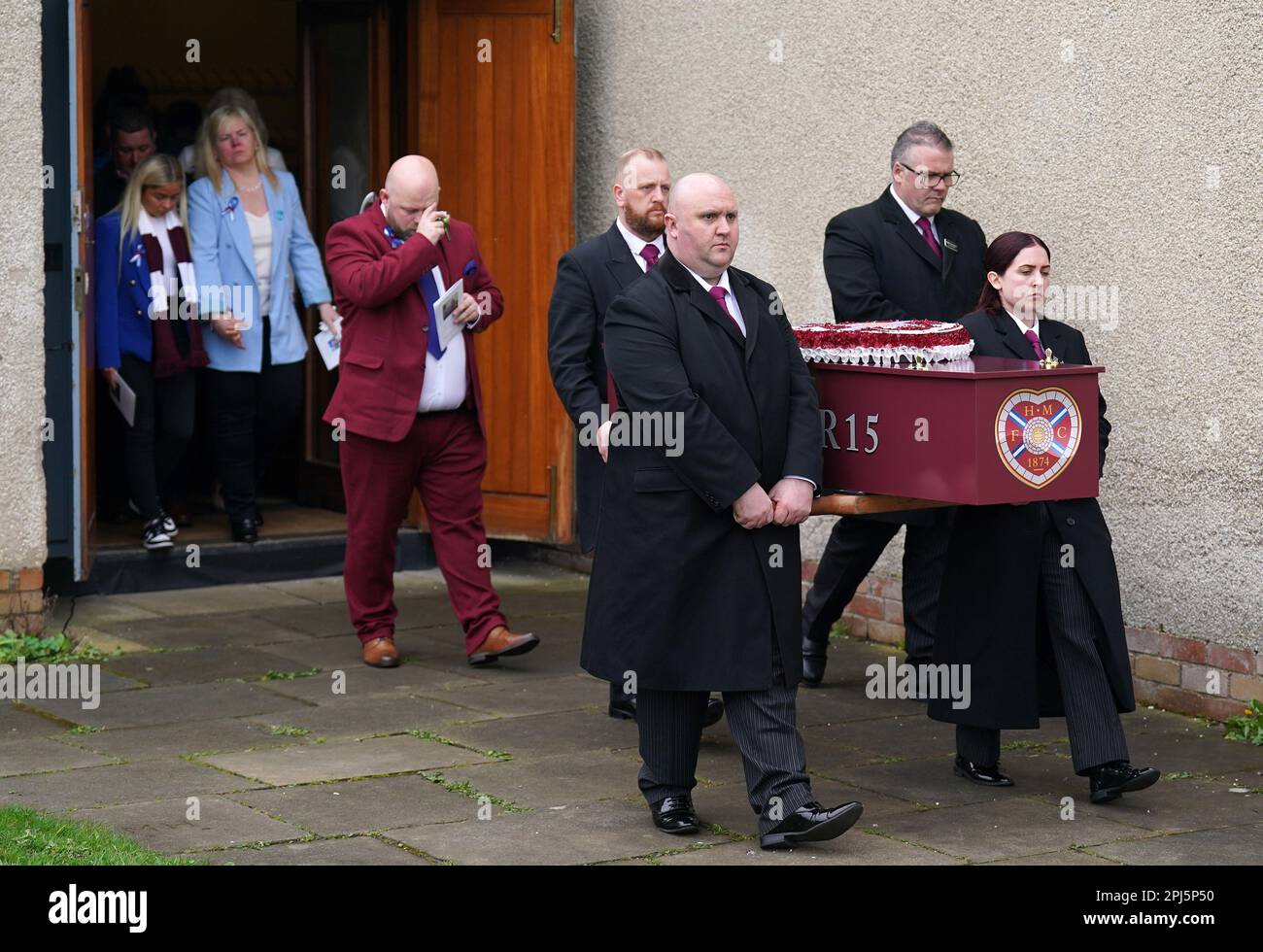 The coffin is carried from the church after the funeral of Andrew ...