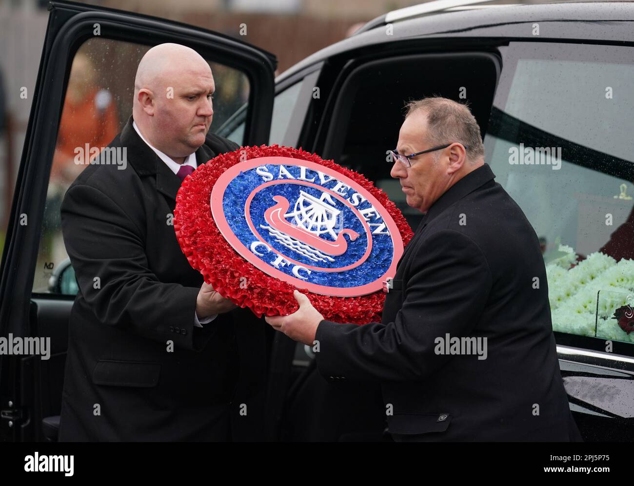 Floral tributes at the funeral of Andrew MacKinnon at St David's Church ...