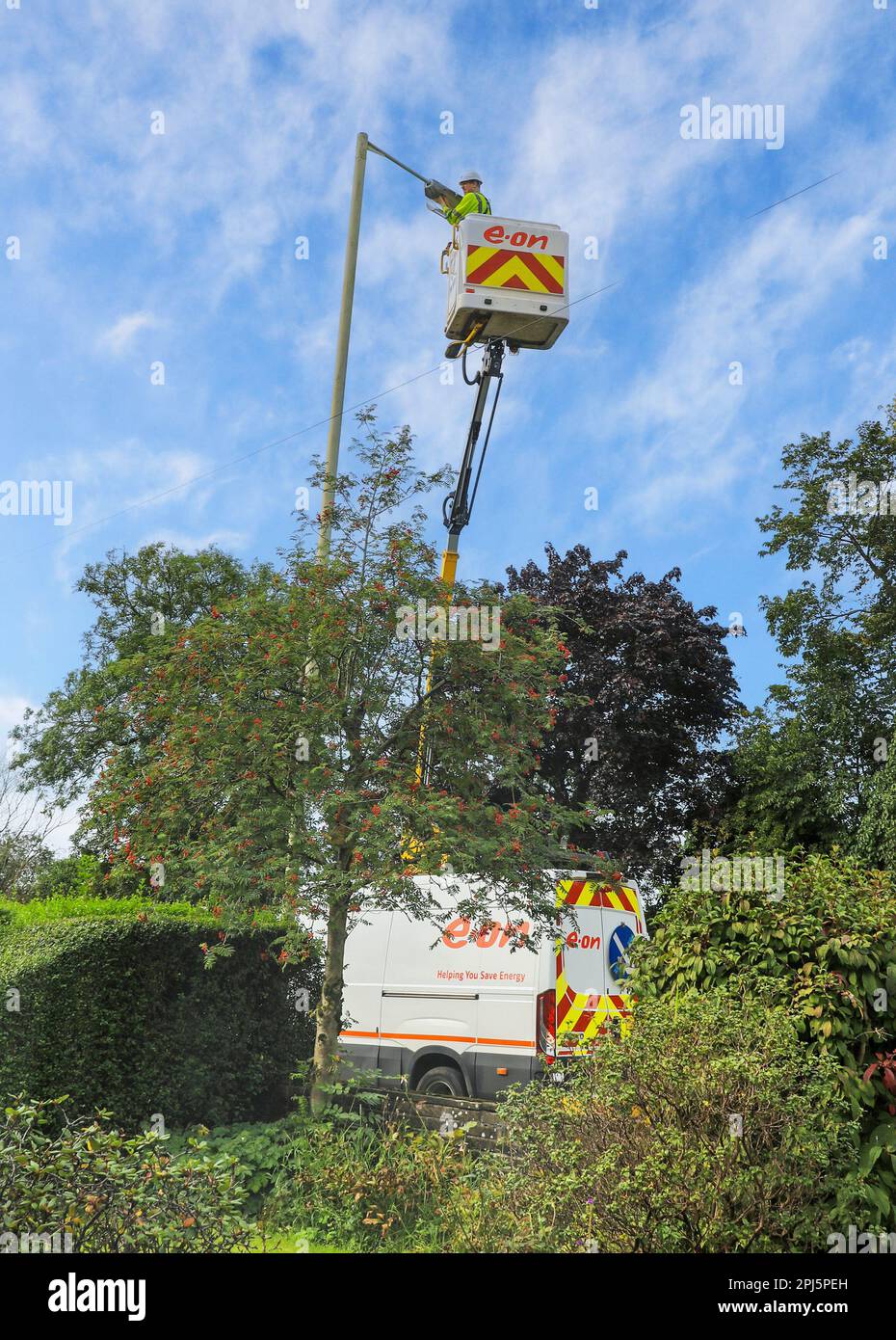An EON employee mending or repairing a street light high up on a Cherry ...