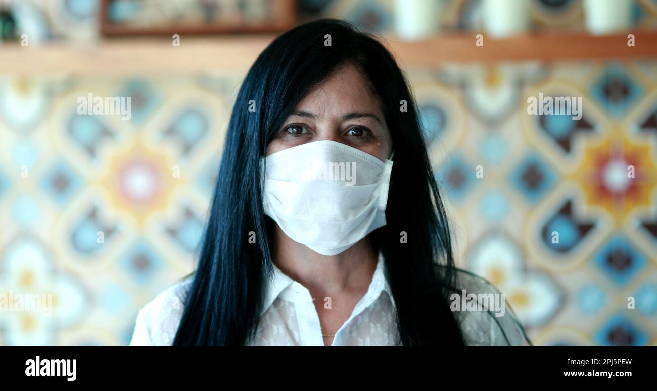 Latina hispanic older woman wearing covid-19 face mask virus pandemic ...