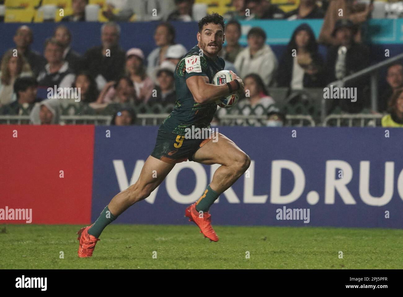Australia's Matthew Gonzalez runs to score a try against Japan during ...