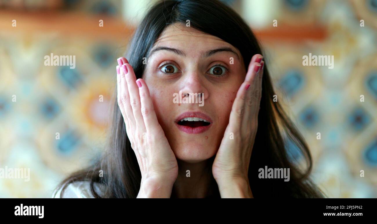 Woman shock reaction looking at camera, casual happy attractive woman ...