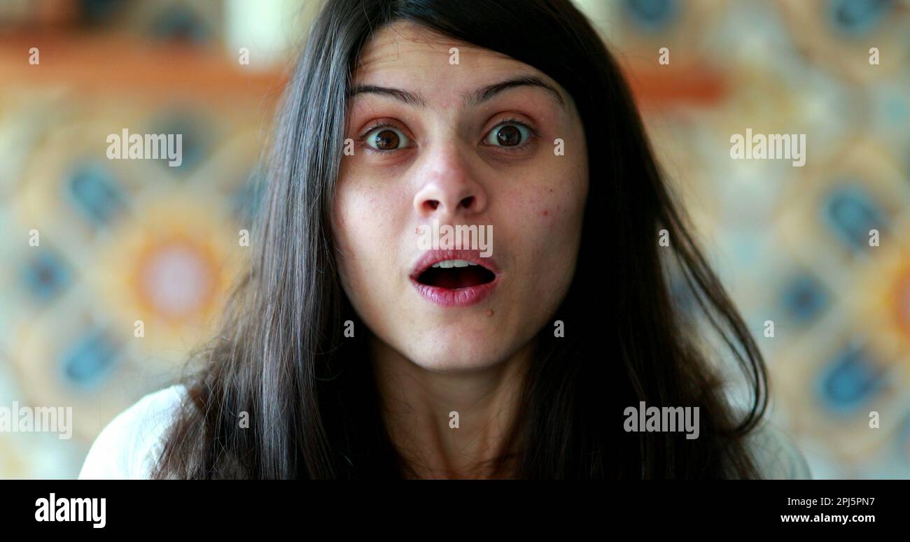 Woman shock reaction looking at camera, casual happy attractive woman ...