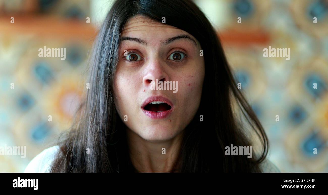 Woman shock reaction looking at camera, casual happy attractive woman ...