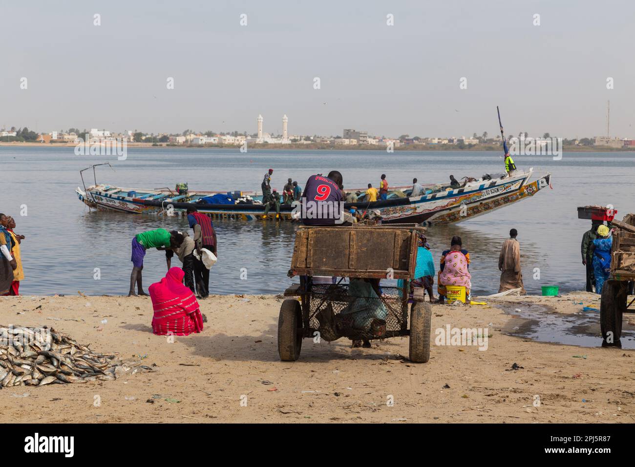 Dakar, Senegal. August 18, 2019: People buying and selling just landed ...