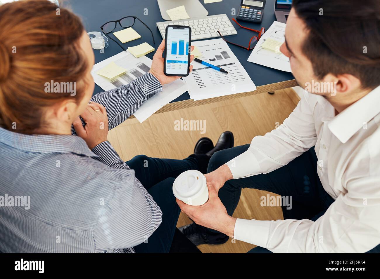 Business colleagues discussing financial data working together in ...