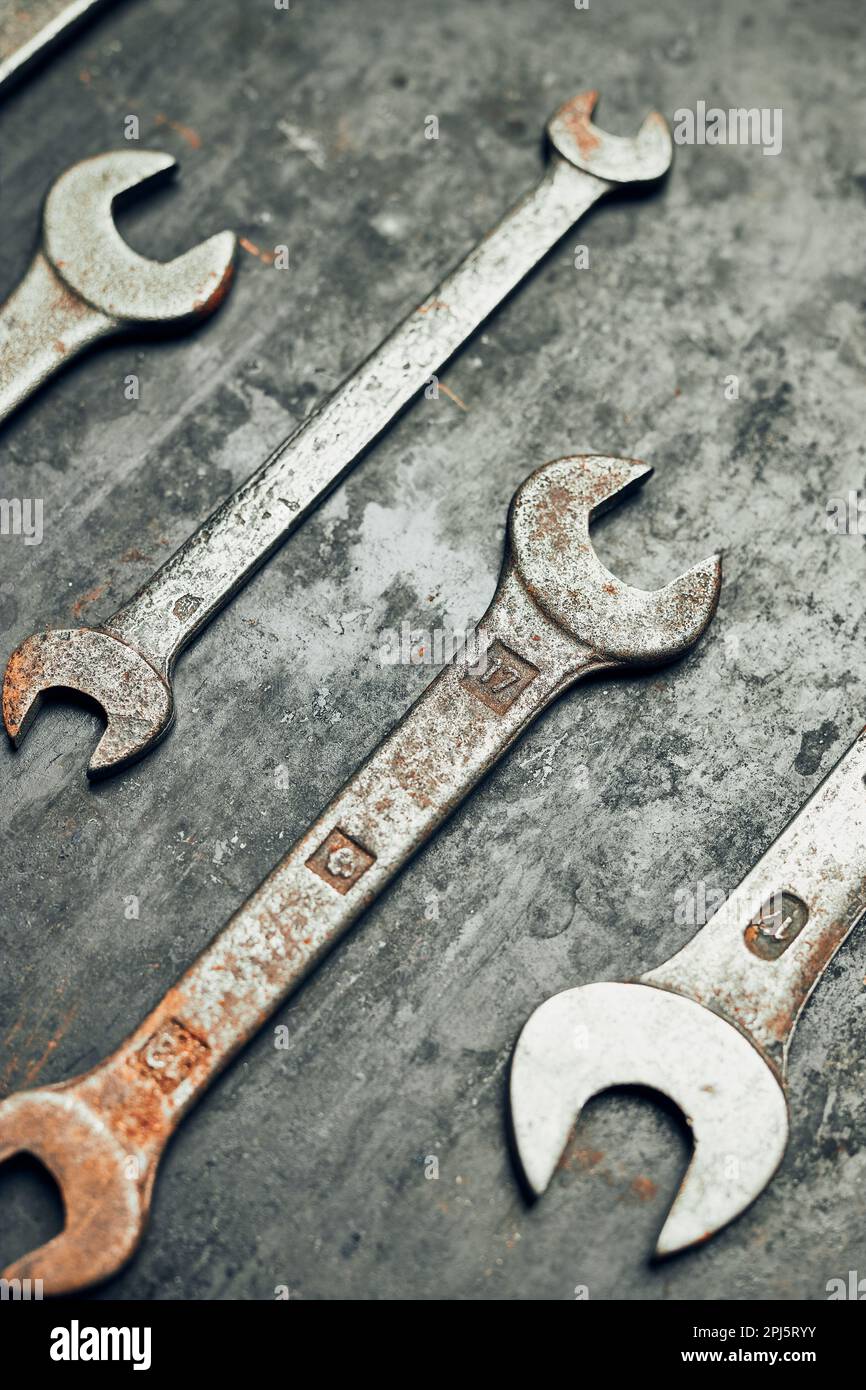 Spanners on steel surface. Old rusty wrenches for maintenance. Mechanic ...