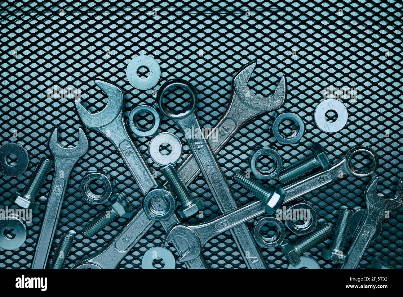 Set of chrome wrenches on steel surface. Mechanic tools for maintenance ...