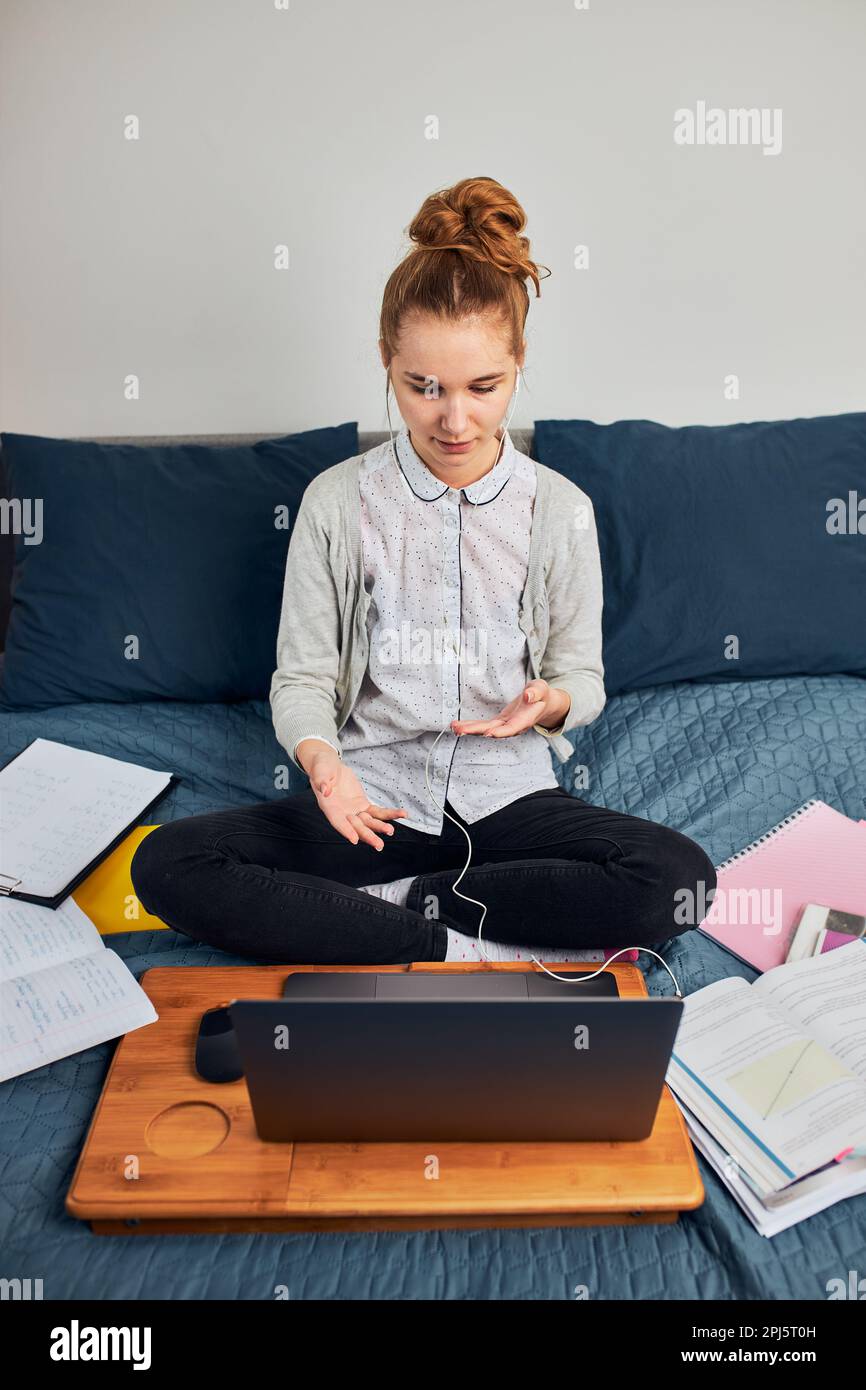 Young woman student having classes, learning online, watching lesson ...