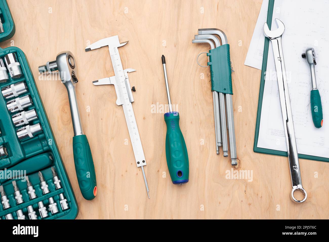 Workshop table with many tools. Wrench, spanner, calliper and ratchet ...