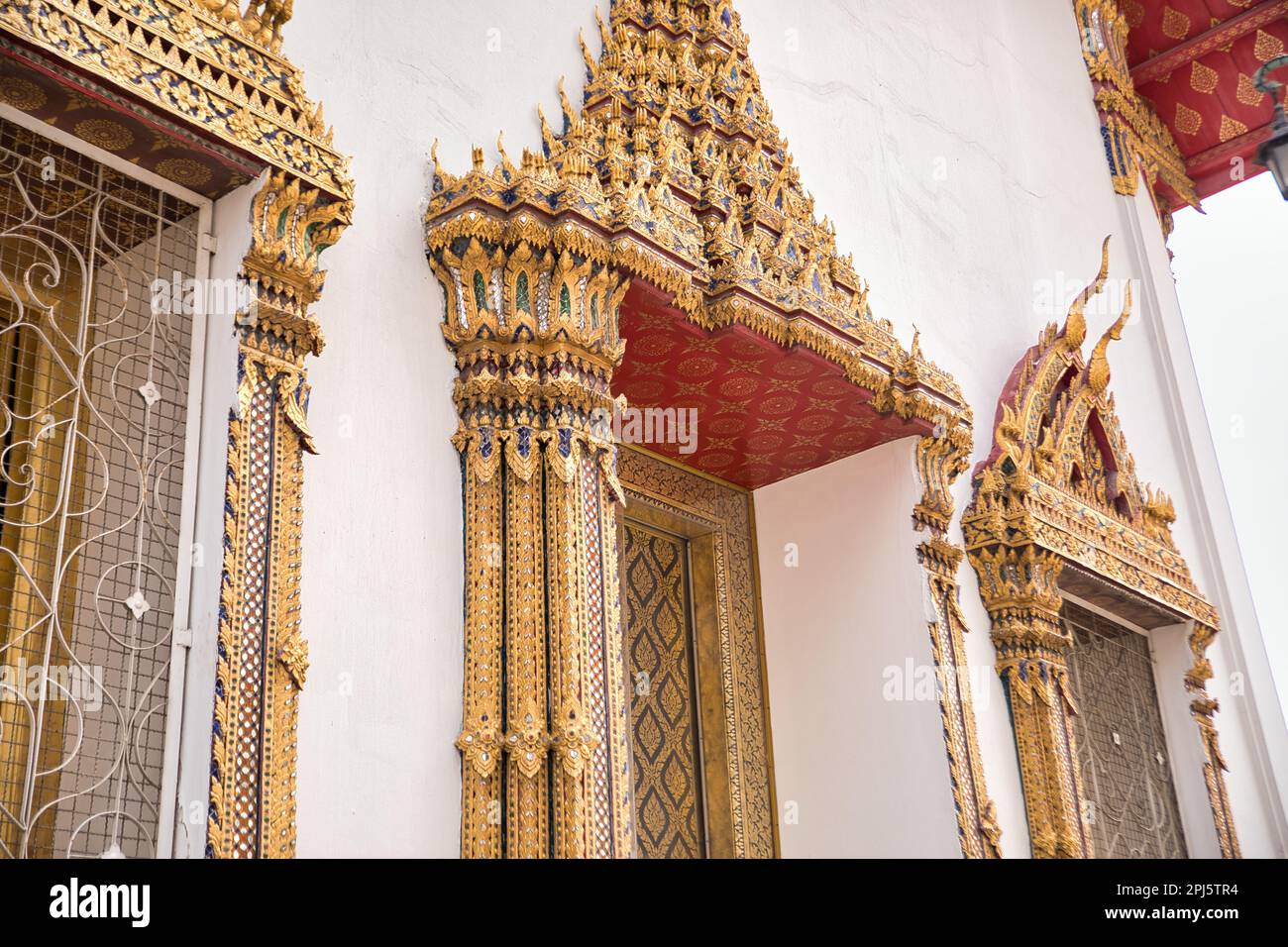 A gold detailed door at Wat Pho temple temple in Bangkok, Thailand ...