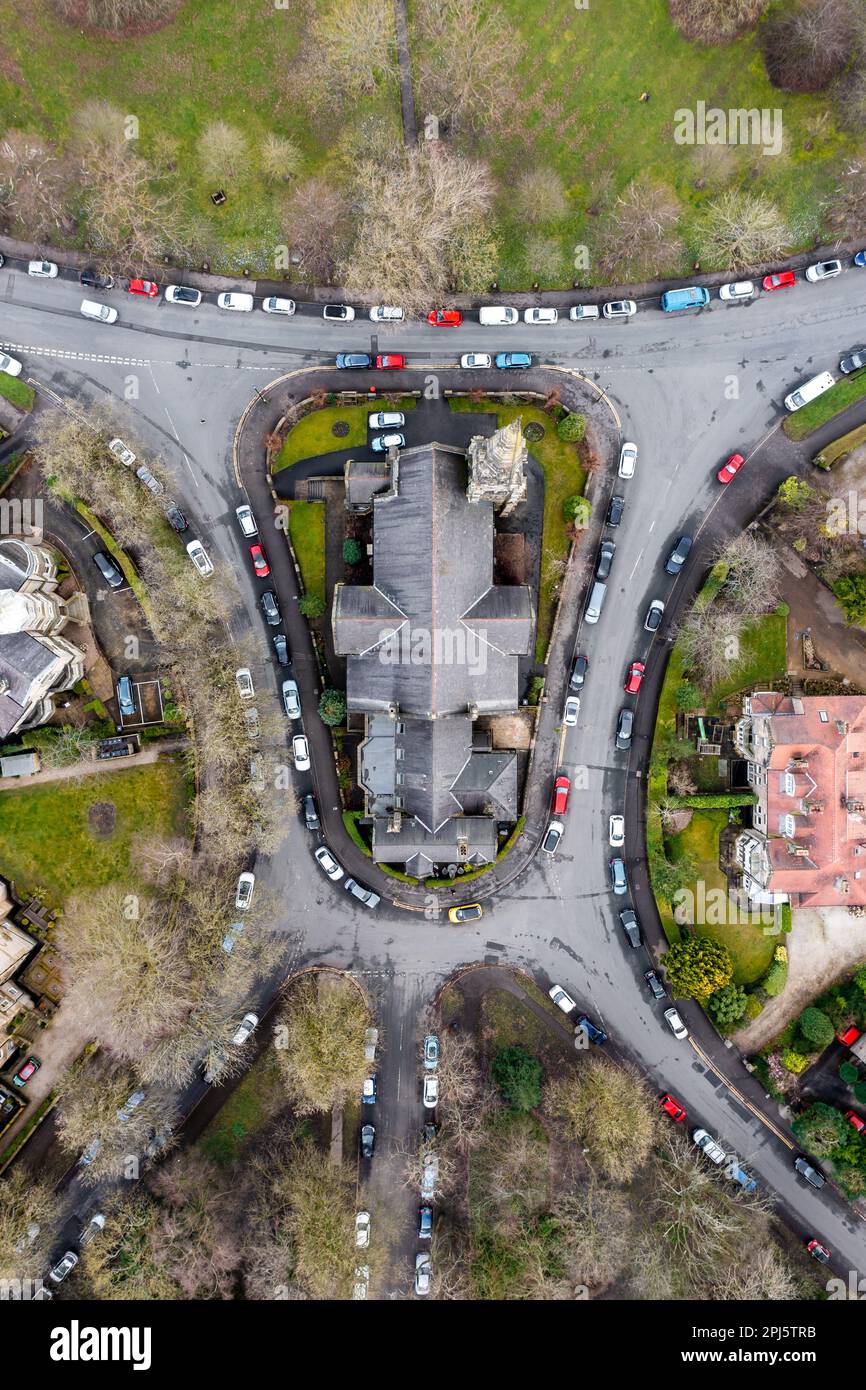 Aerial view directly above a church at the heart of a local community ...